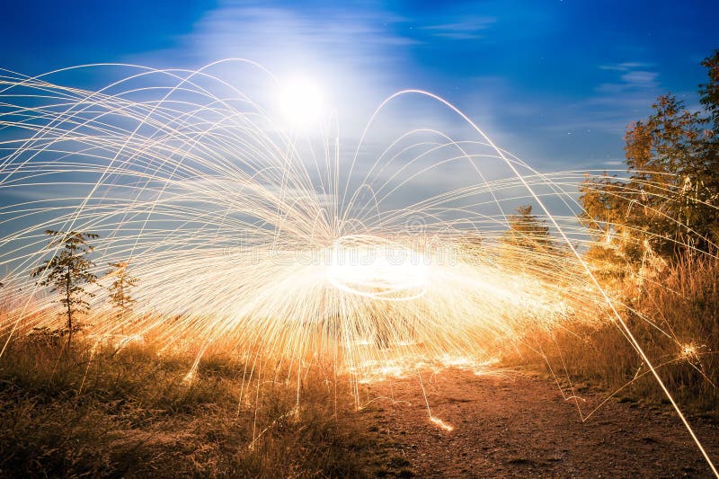 Firetrail of Sparks Flying through the Air Creating Fire Trails Stock ...