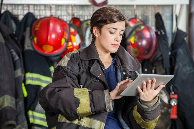 Firewoman Using Digital Tablet at Fire Station Stock Image - Image of ...