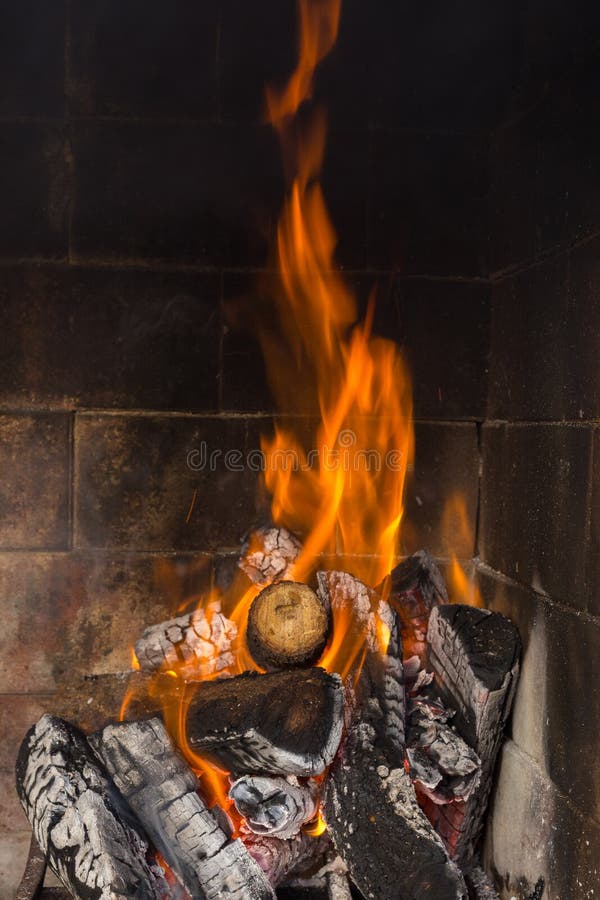 Firewood Burning. Fire in a Fireplace. Making the Embers for a Barbecue ...