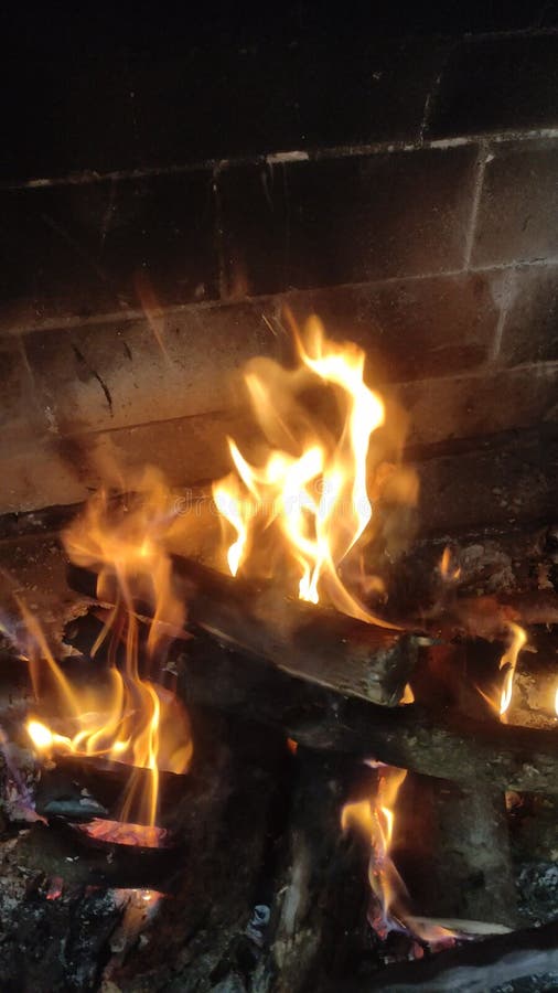 Firewood Burning in the Fireplace, Concept of Calm and Coziness Stock ...