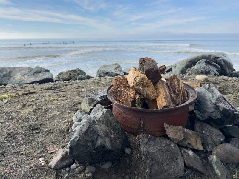 Firewood in a Firepit by the Ocean Stock Photo - Image of firepit ...