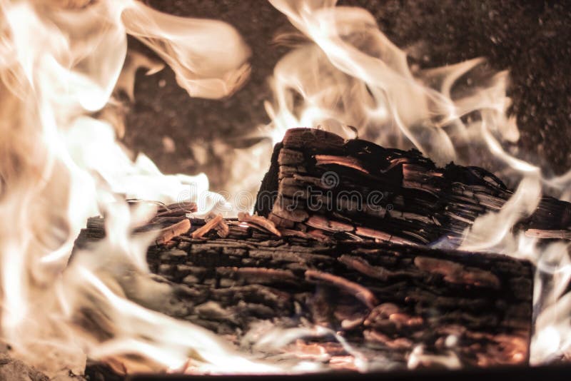 Firewood in hot flames stock image. Image of flames - 140948835