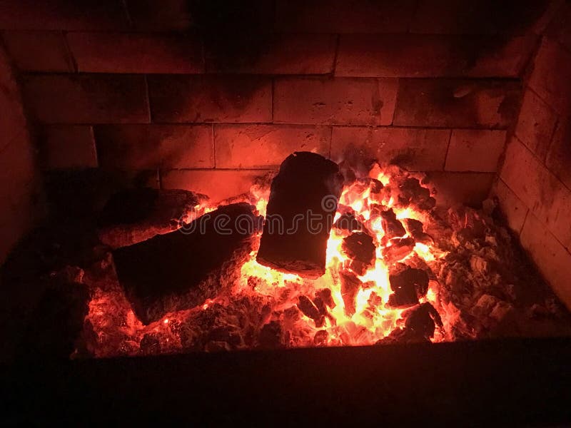 Firewood lit in the stove stock photo. Image of energy - 332942144