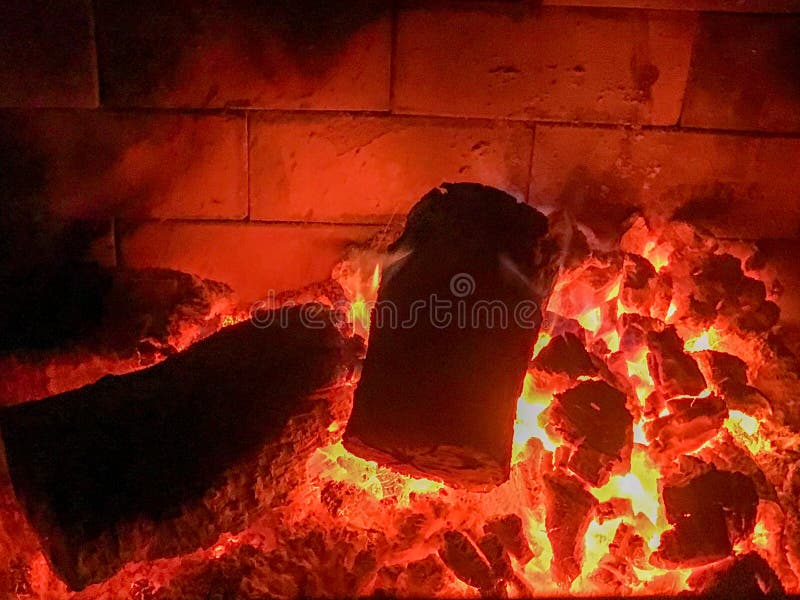 Firewood lit in the stove stock image. Image of fire - 332942171