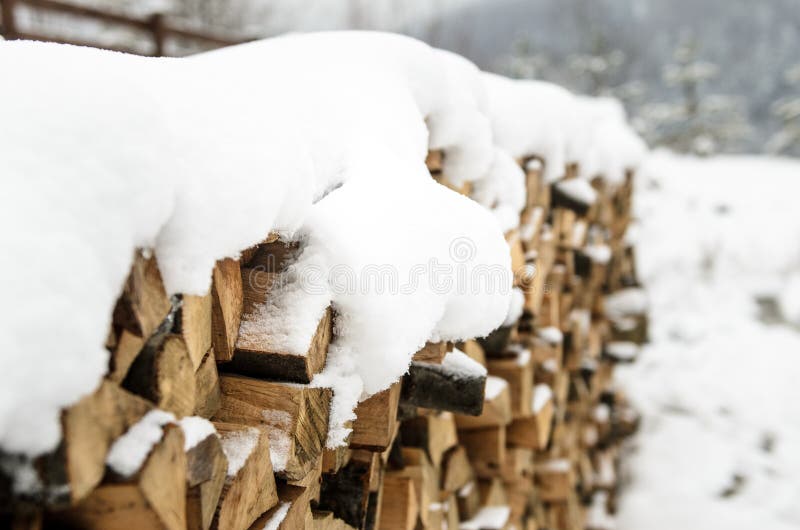 Firewood in the snow stock image. Image of timber, wooden - 70204229