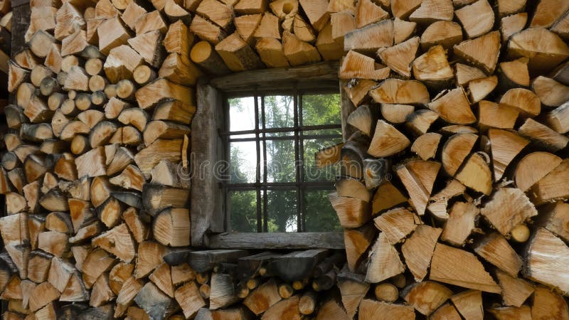 Firewood Stack of Logs Framing a House Window Stock Image - Image of ...