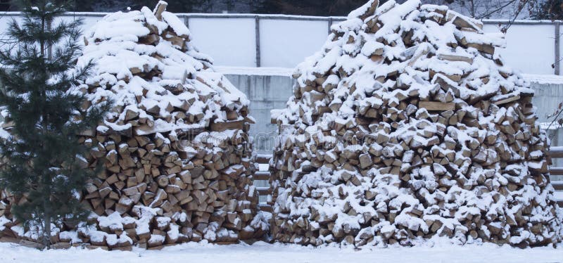 Firewood stacked in winter stock image. Image of fuel - 64814691