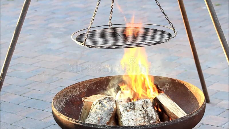 Bbq on hanging grill stock footage. Video of fire, pork - 87819794