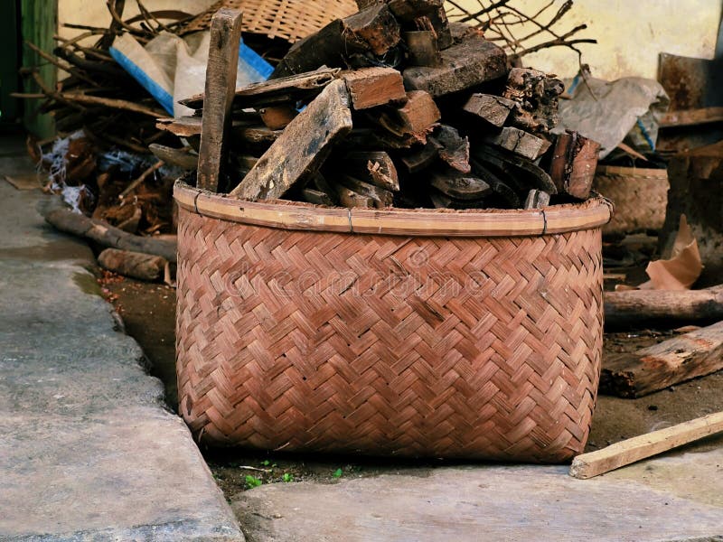 Firewood in a Woven Bamboo Container, a Traditional Way of Making a ...