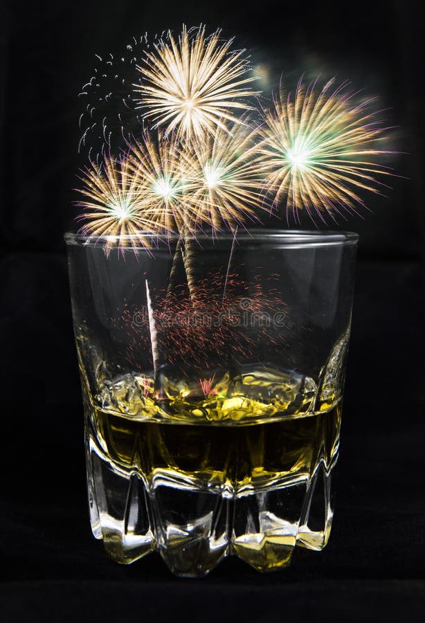Firework on alcohol glass stock photo. Image of drink - 66726390