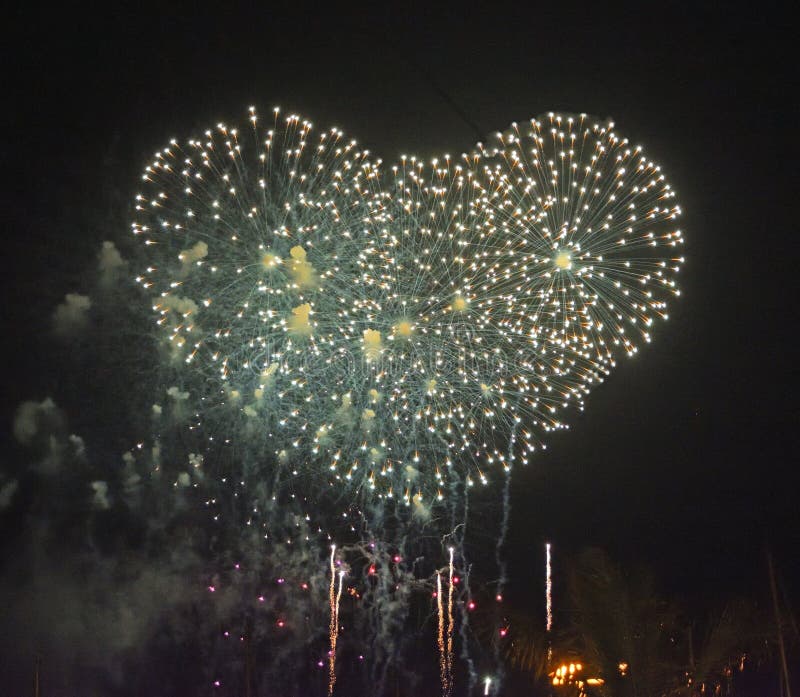 Firework Bursts in Heart Shape Against Night Sky. Stock Photo - Image ...