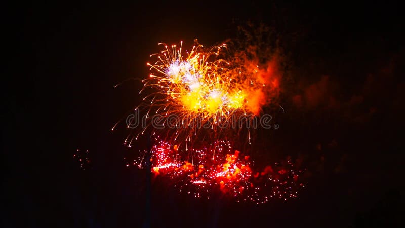 Firework Display at Night on Black Background. Bright Glaring Red Green ...
