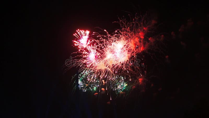 Firework Display at Night on Black Background. Bright Glaring Red Green ...