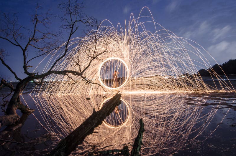 Firework and Fire Swing on Dead Tree Fourground Stock Photo - Image of ...