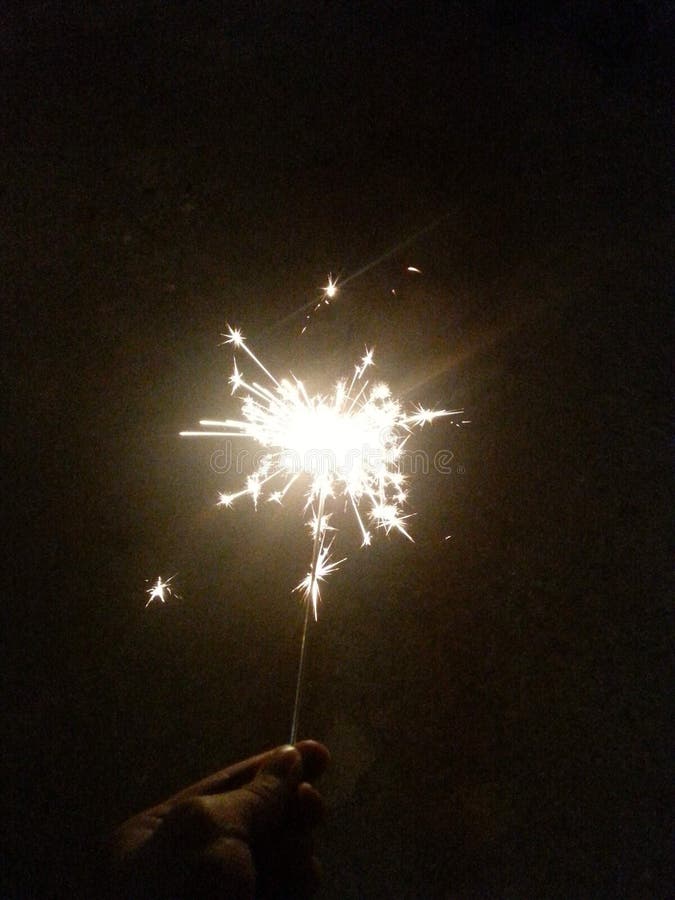 Firework in hand stock image. Image of illuminated, fire - 185540331