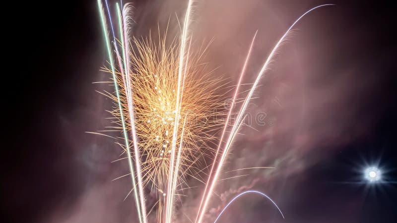 A Firework is Lit Up in the Dark Sky with Stars Stock Image - Image of ...