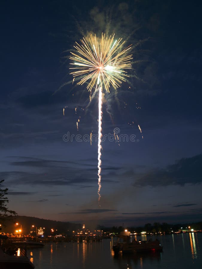Firework over the lake. stock photo. Image of long, fire - 61882552