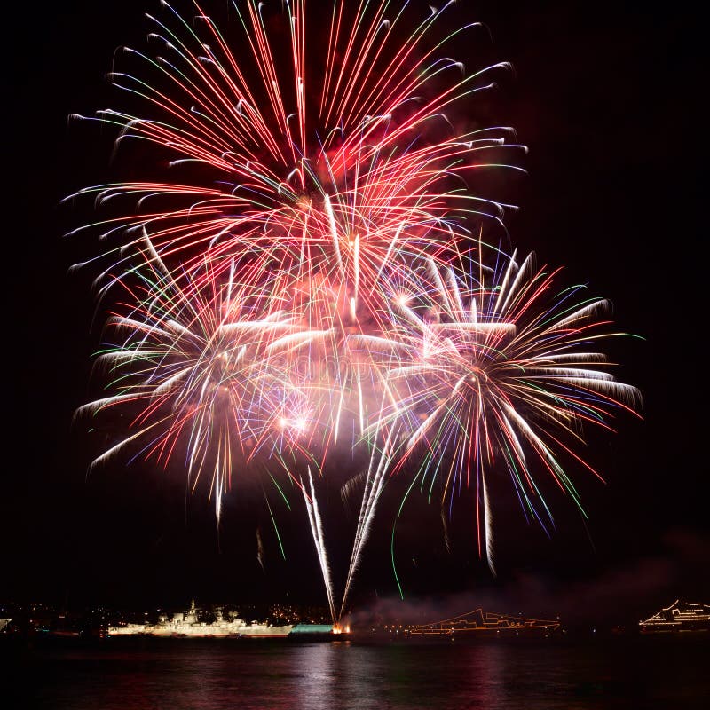 Fireworks over water stock photo. Image of events, celebrate - 38147376