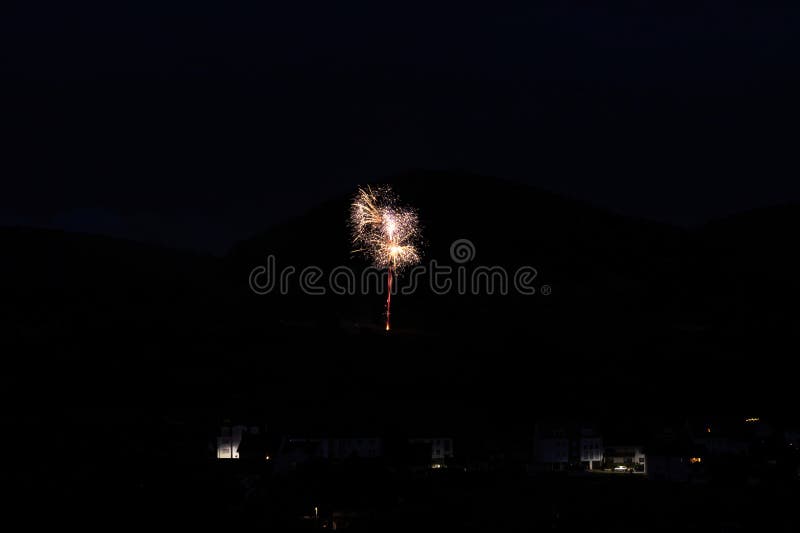 Fireworks in the Dark Night Sky, with a Few Houses in the Foreground ...
