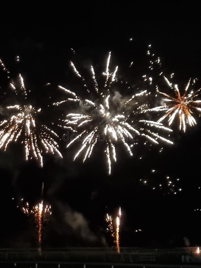 Fireworks on dark sky stock image. Image of bonfire - 233980437