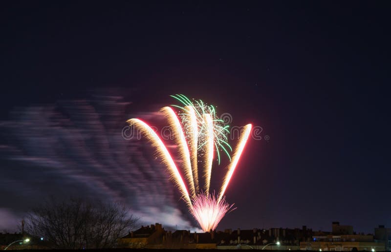 Fireworks Display Lighting Up the Night Sky Over a Cityscape with ...