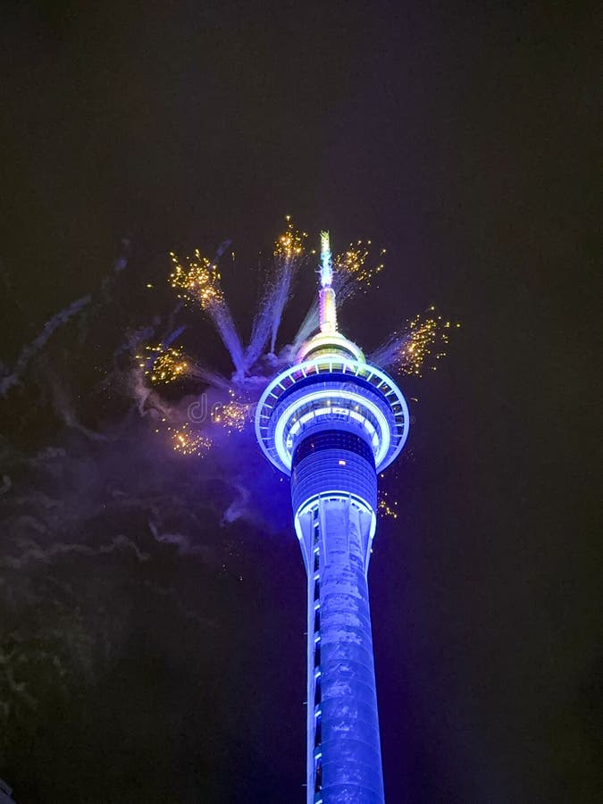 Fireworks Display at Night by Illuminated Tower Editorial Photography ...