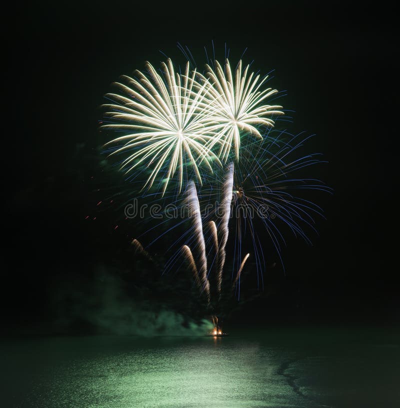 Fireworks Display Over Sea with Reflections in Water Stock Photo ...