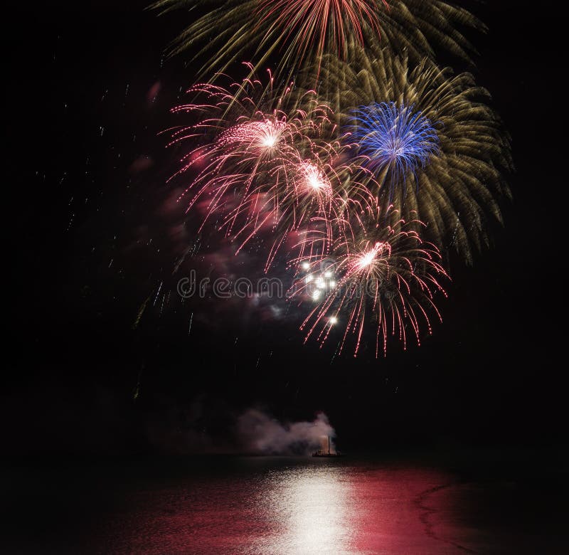Fireworks Display Over Sea with Reflections in Water Stock Photo ...