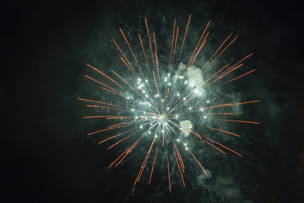 Fireworks Display in the Smoky Night Sky. Stock Photo - Image of ...