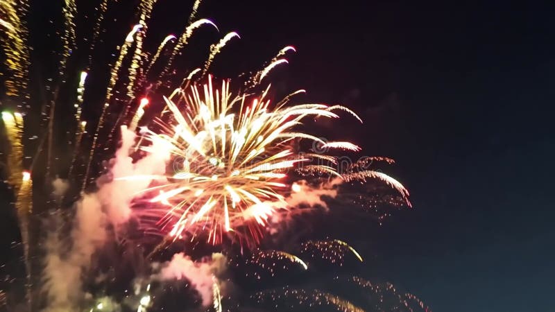 Fireworks Explode in the Dark Sky As an FPV Drone Flies through ...