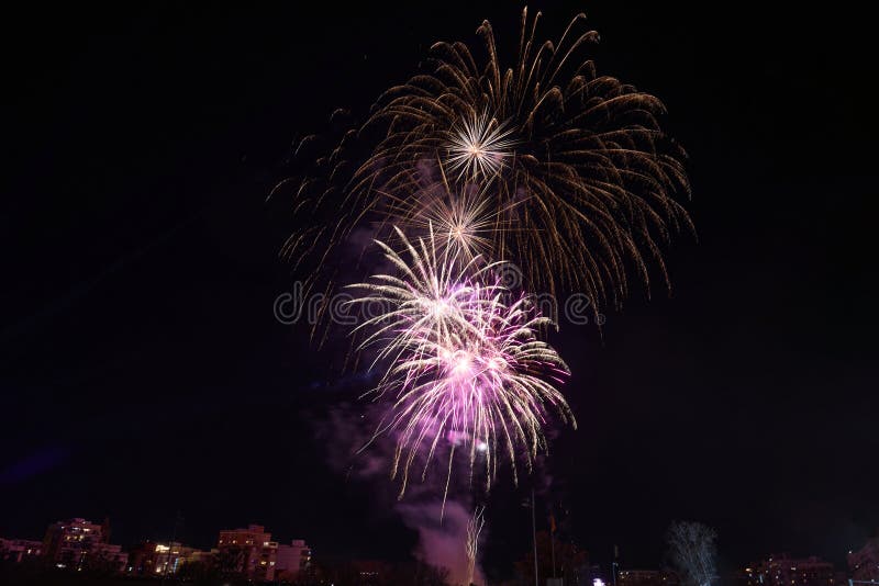 Fireworks Exploding in the Dark Night Sky during a Celebration Stock ...