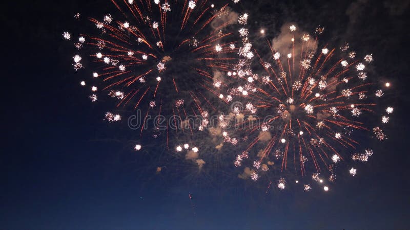 Fireworks Exploding Over the Ocean at Night Stock Photo - Image of ...