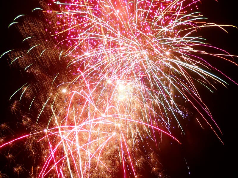 Fireworks Exploding Over the Ocean at Night Stock Photo - Image of ...