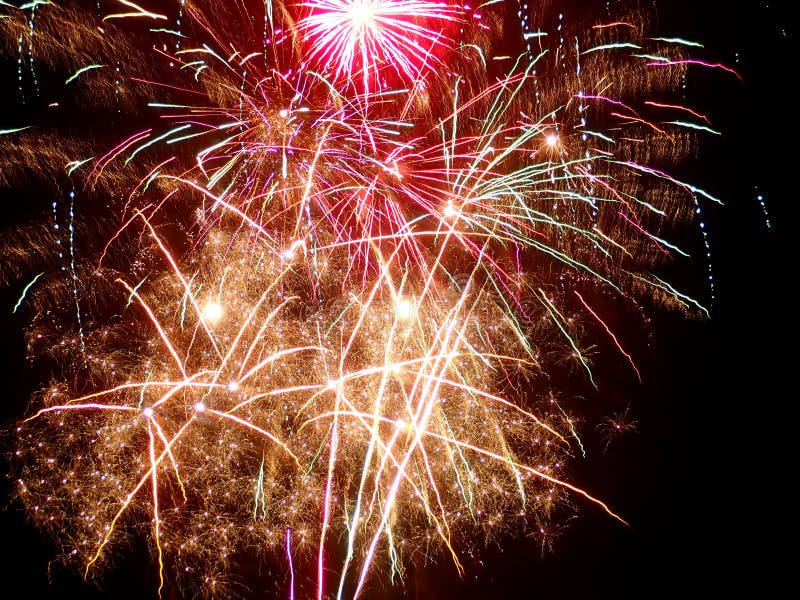 Fireworks Exploding Over the Ocean at Night Stock Photo - Image of ...