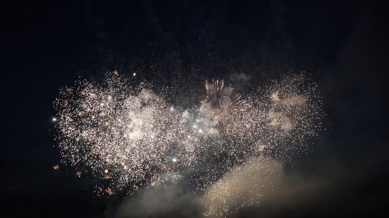 Fireworks Exploding Over the Ocean at Night Stock Photo - Image of ...