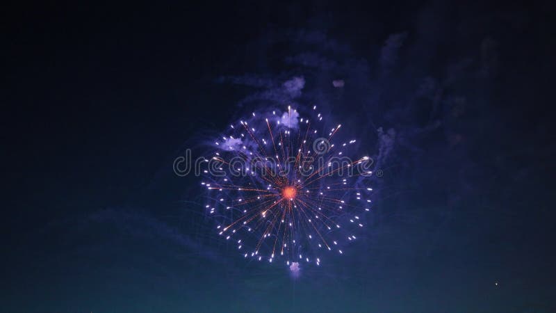 Fireworks Exploding Over the Ocean at Night Stock Photo - Image of ...