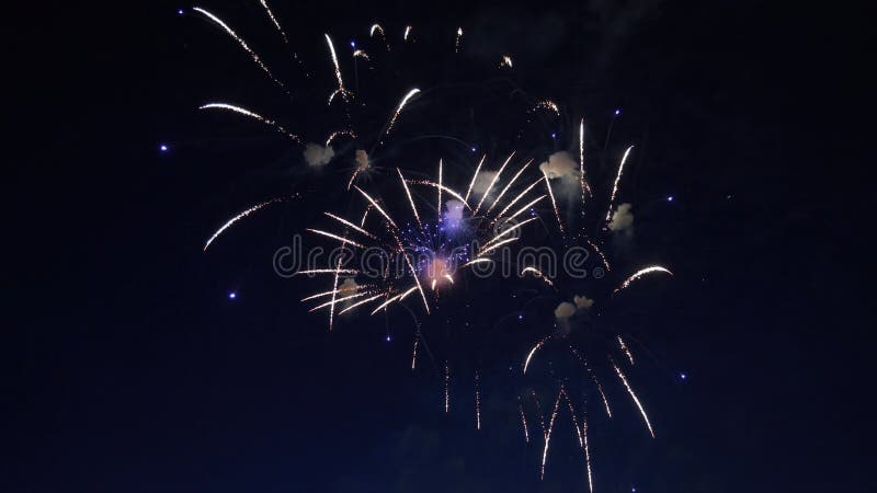 Fireworks Exploding Over the Ocean at Night Stock Photo - Image of ...
