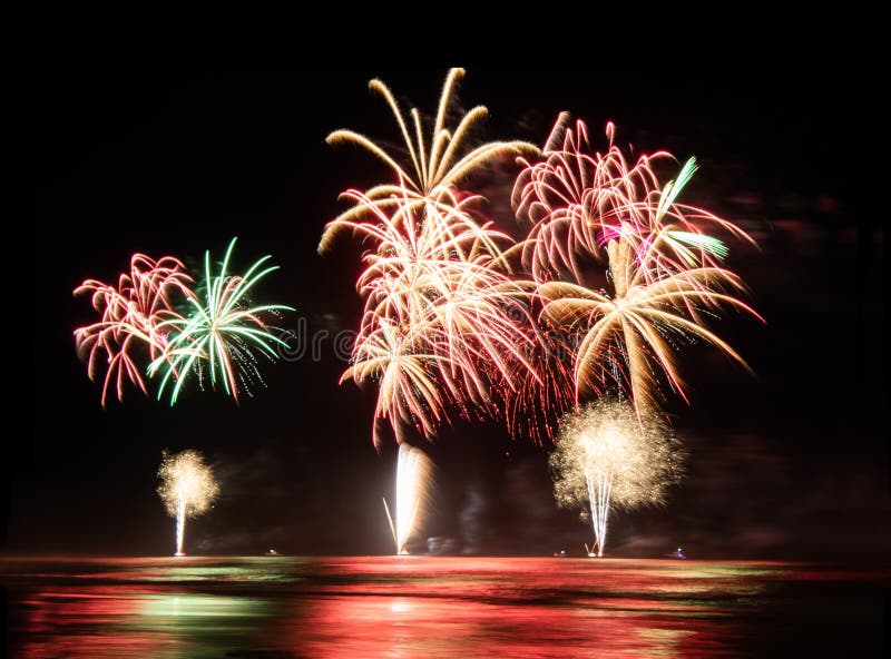 Fireworks Exploding Over the Ocean at Night Showing Coloured ...