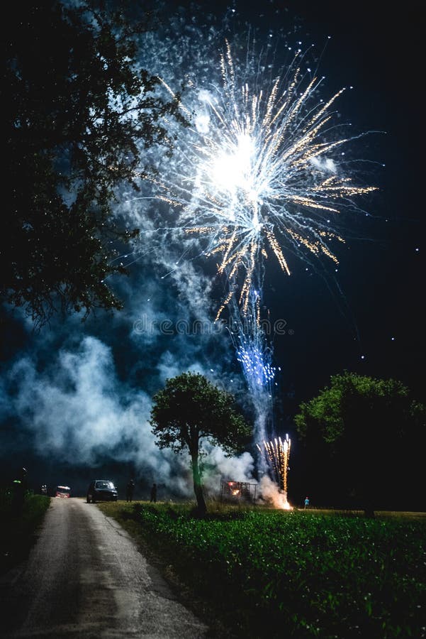 Fireworks in a Field between Trees Stock Image - Image of outdoors ...