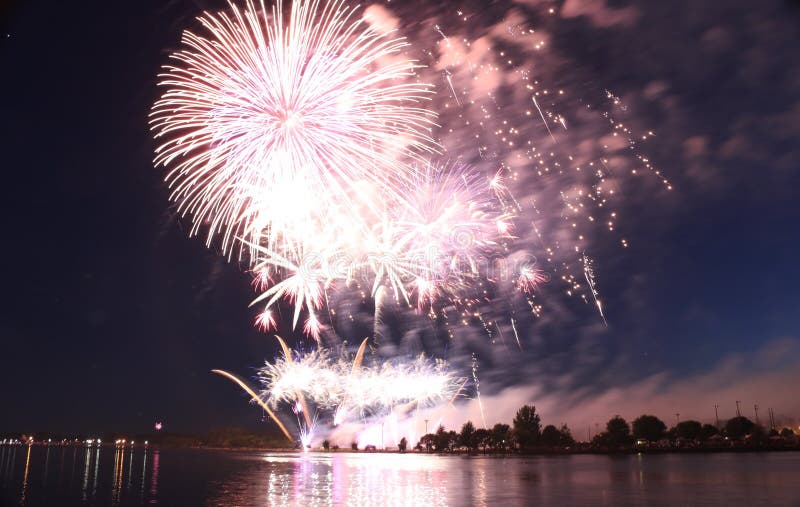 Fireworks Finale Over Water Stock Photo - Image of finale, bright ...