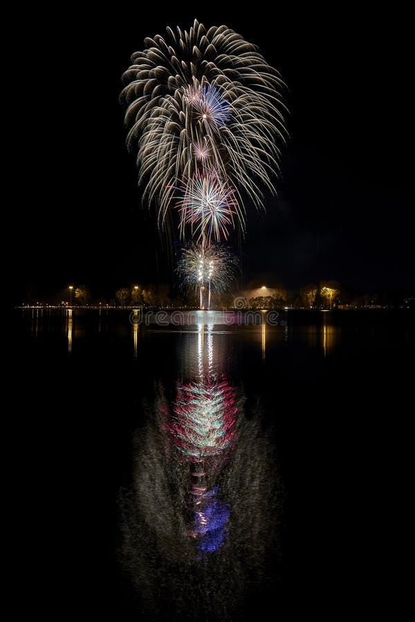 Fireworks at the lake stock image. Image of explosion - 67700003