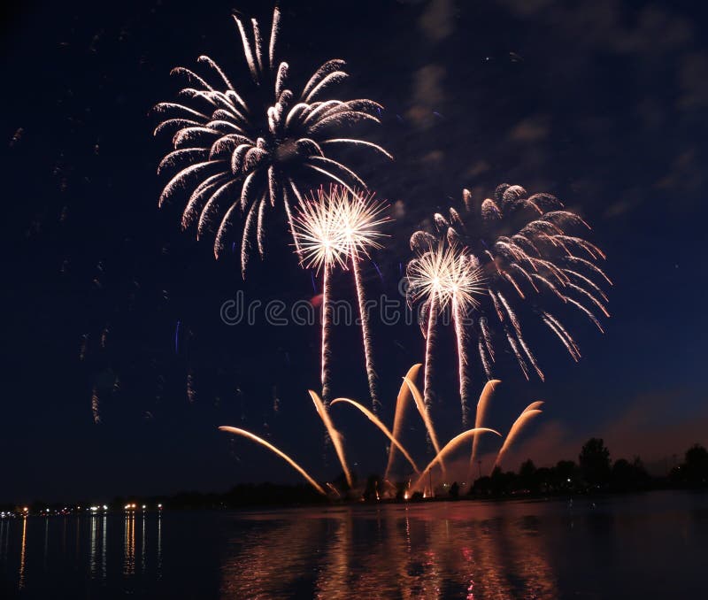 Fireworks Over Water stock photo. Image of reflection - 149006456