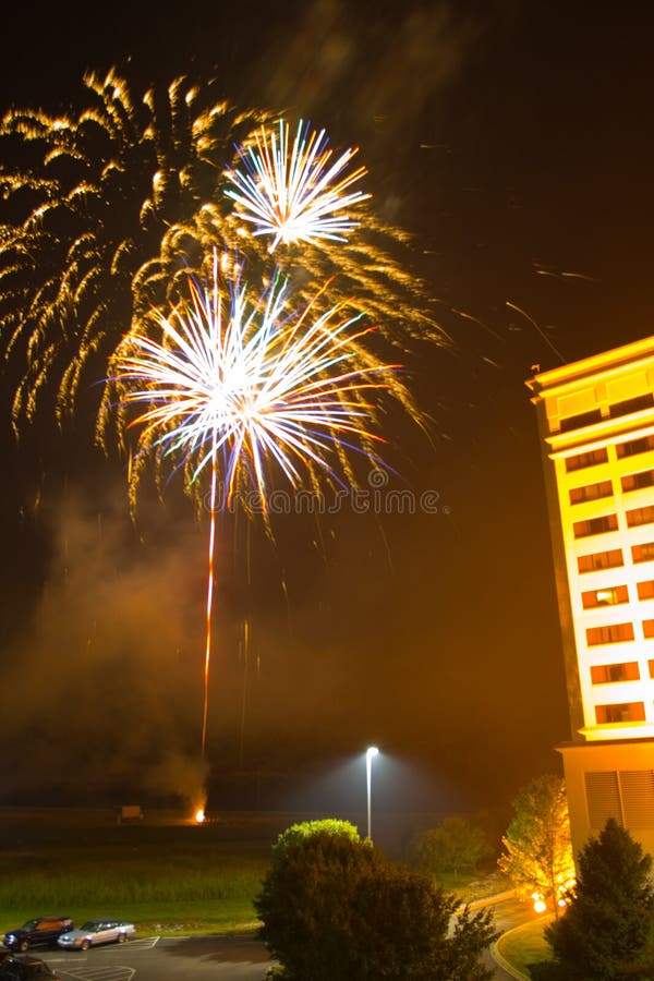 View of Fireworks Next To a Tall Building Stock Image - Image of tall ...