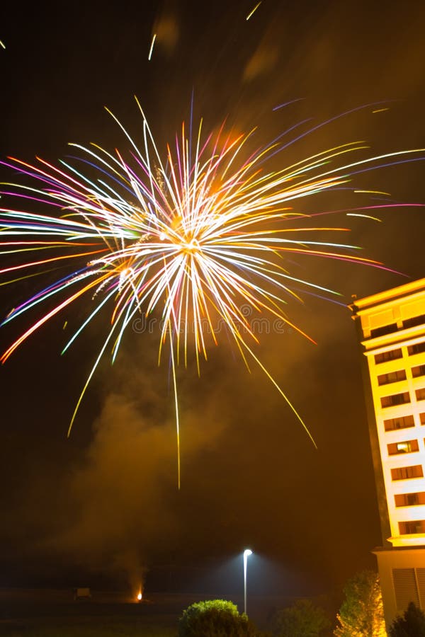 View of Fireworks Next To a Tall Building Stock Image - Image of tall ...