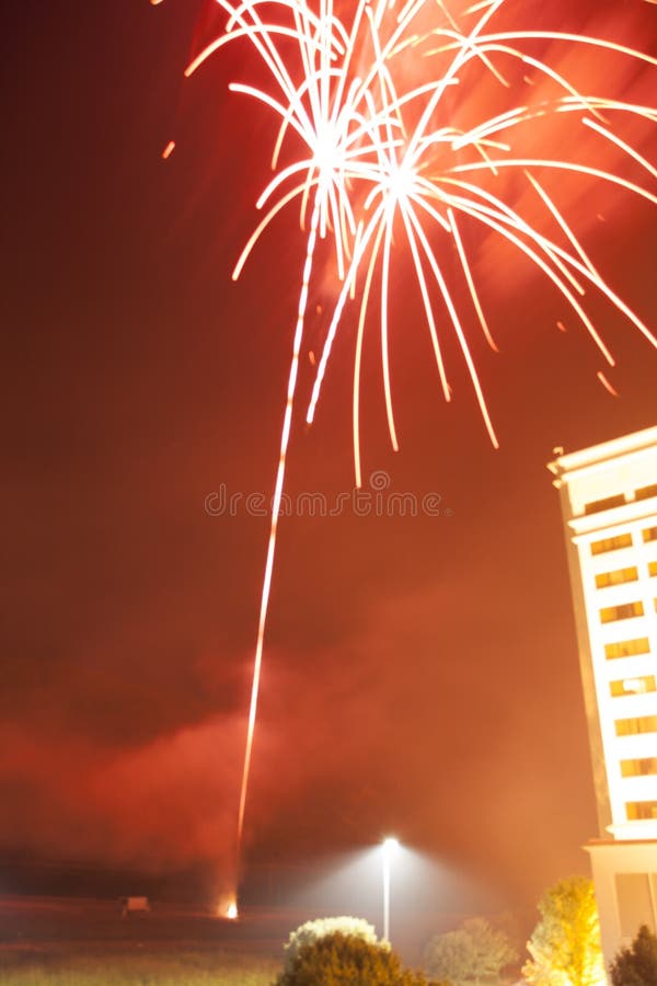 View of Fireworks Next To a Tall Building Stock Photo - Image of ...