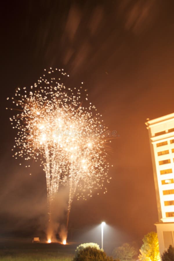 View of Fireworks Next To a Tall Building Stock Photo - Image of night ...