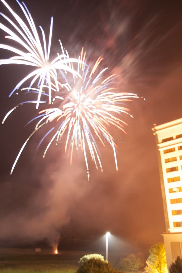 View of Fireworks Next To a Tall Building Stock Image - Image of ...