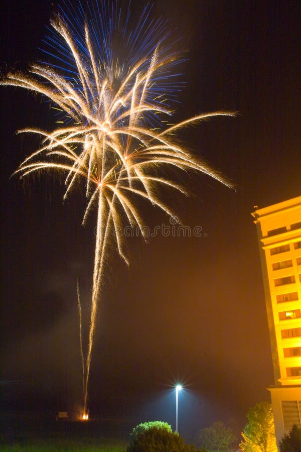 View of Fireworks Next To a Tall Building Stock Image - Image of ...