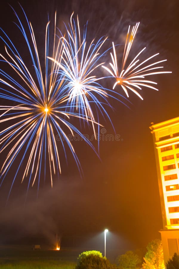 View of Fireworks Next To a Tall Building Stock Photo - Image of ...