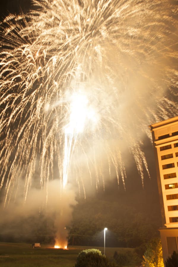 View of Fireworks Next To a Tall Building Stock Photo - Image of ...